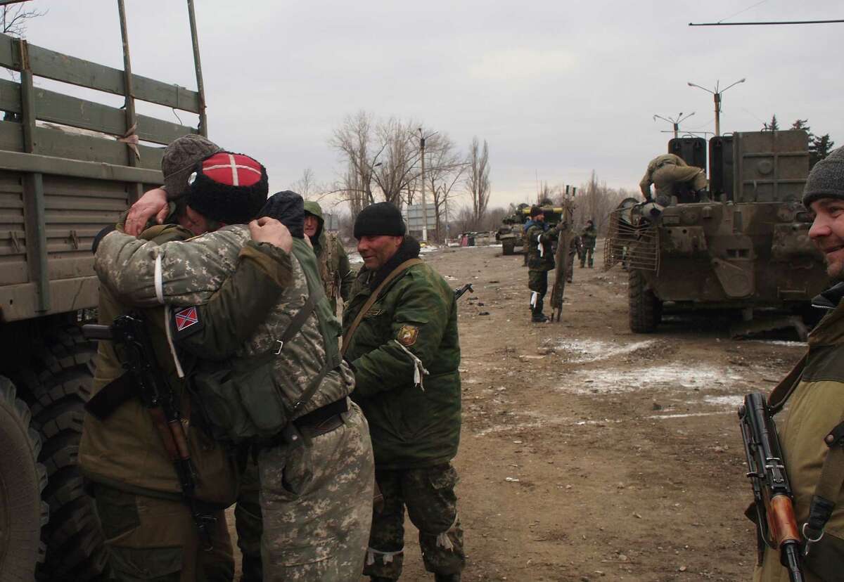 Rebels celebrate amid destruction