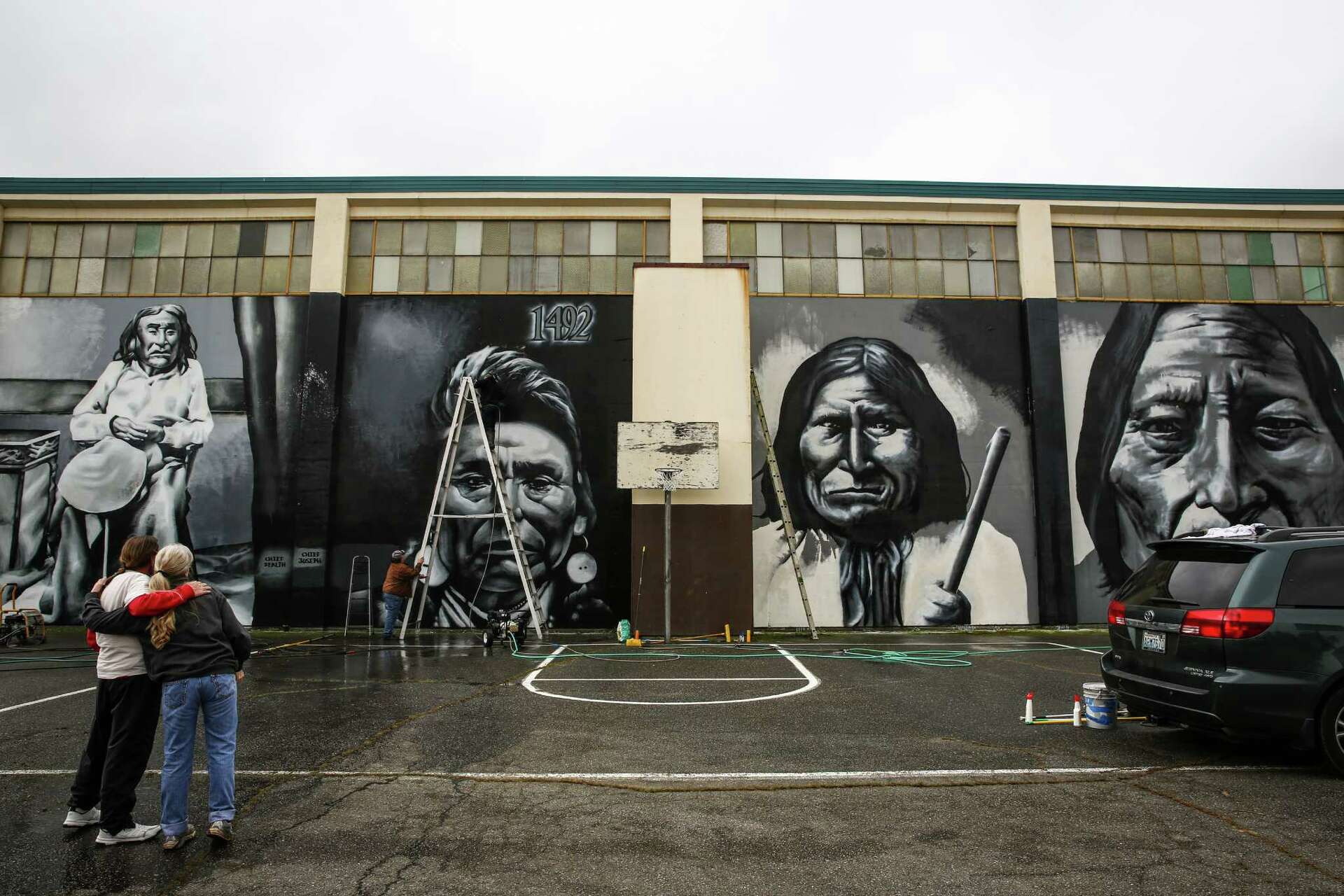 Native American murals restored after damage by vandals