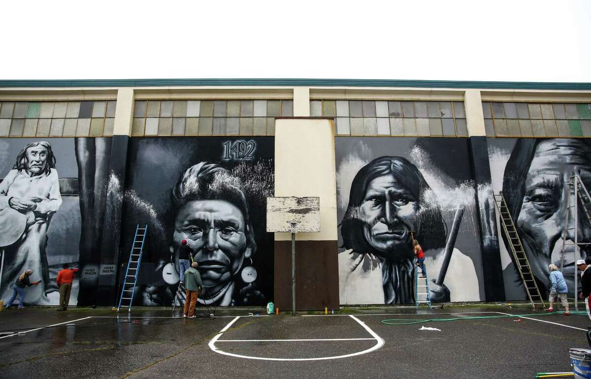 Native American murals restored after damage by vandals