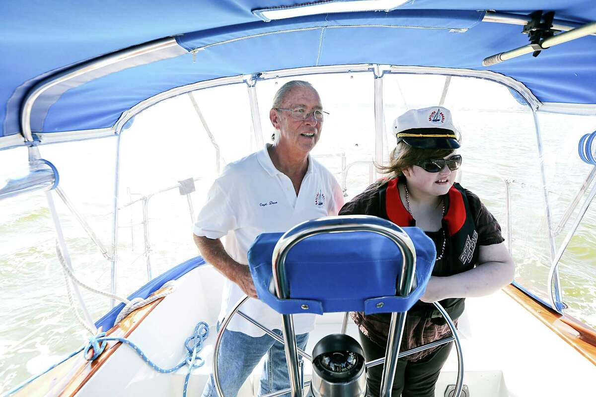 Dave McCabe takes children and veterans out on the water to work a ...