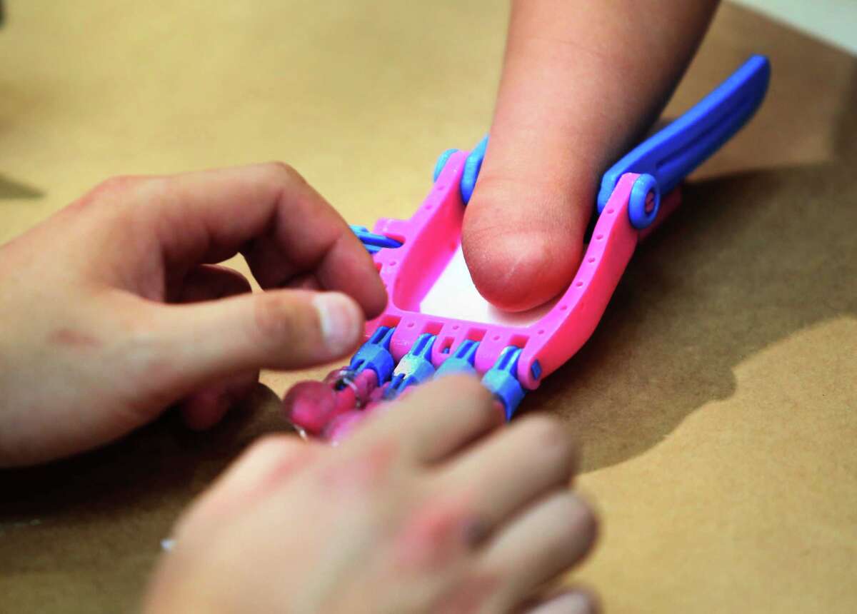 Volunteers team up to create custom-made mechanical hands for young ...