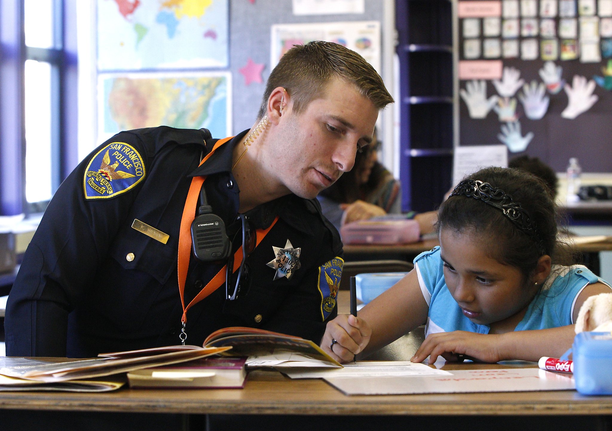 Cop throws the book at Bayview kids as reading tutor