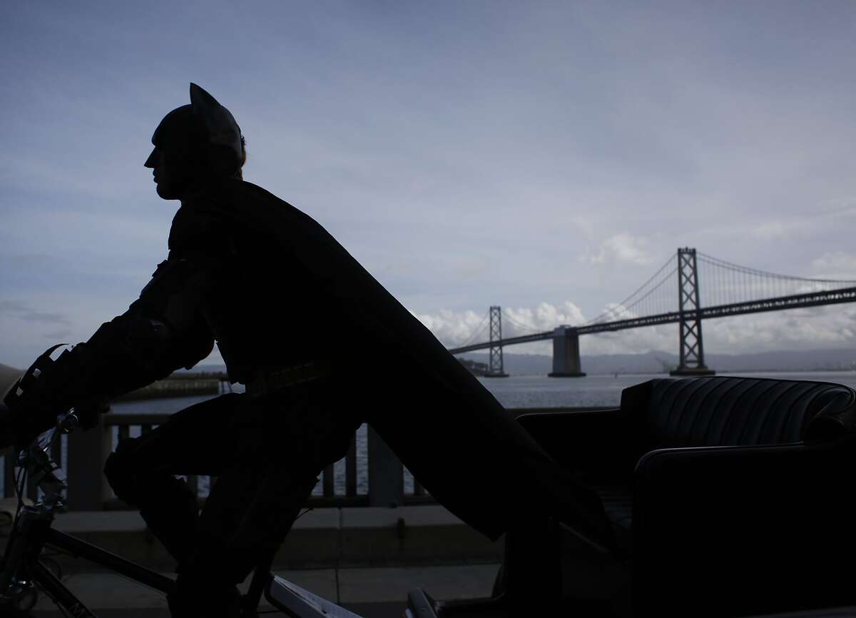 S.F. pedicab driver 'a hero’ in his Batman suit