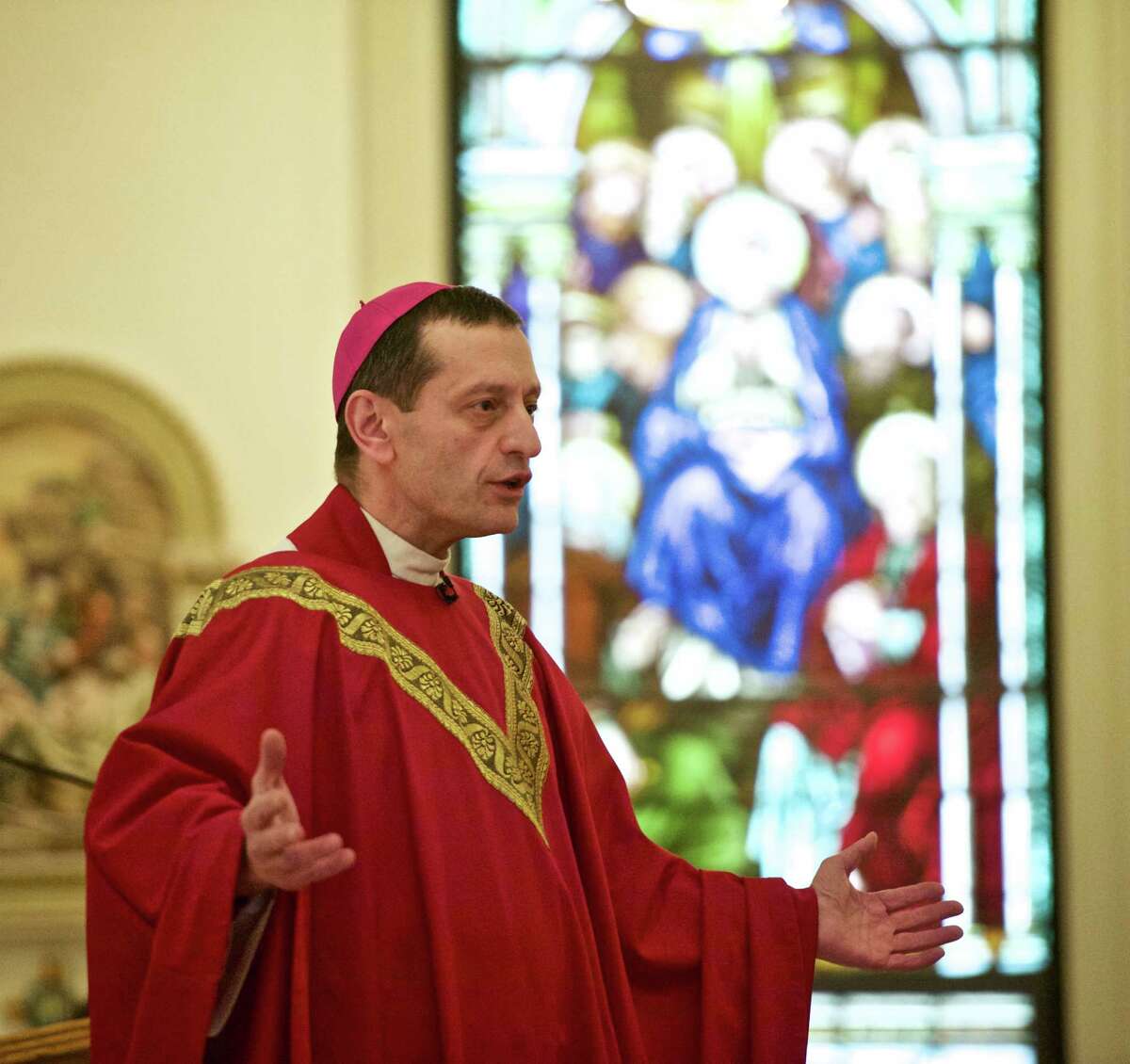 Bishop attends veneration of the Cross service at Saint Joseph Church