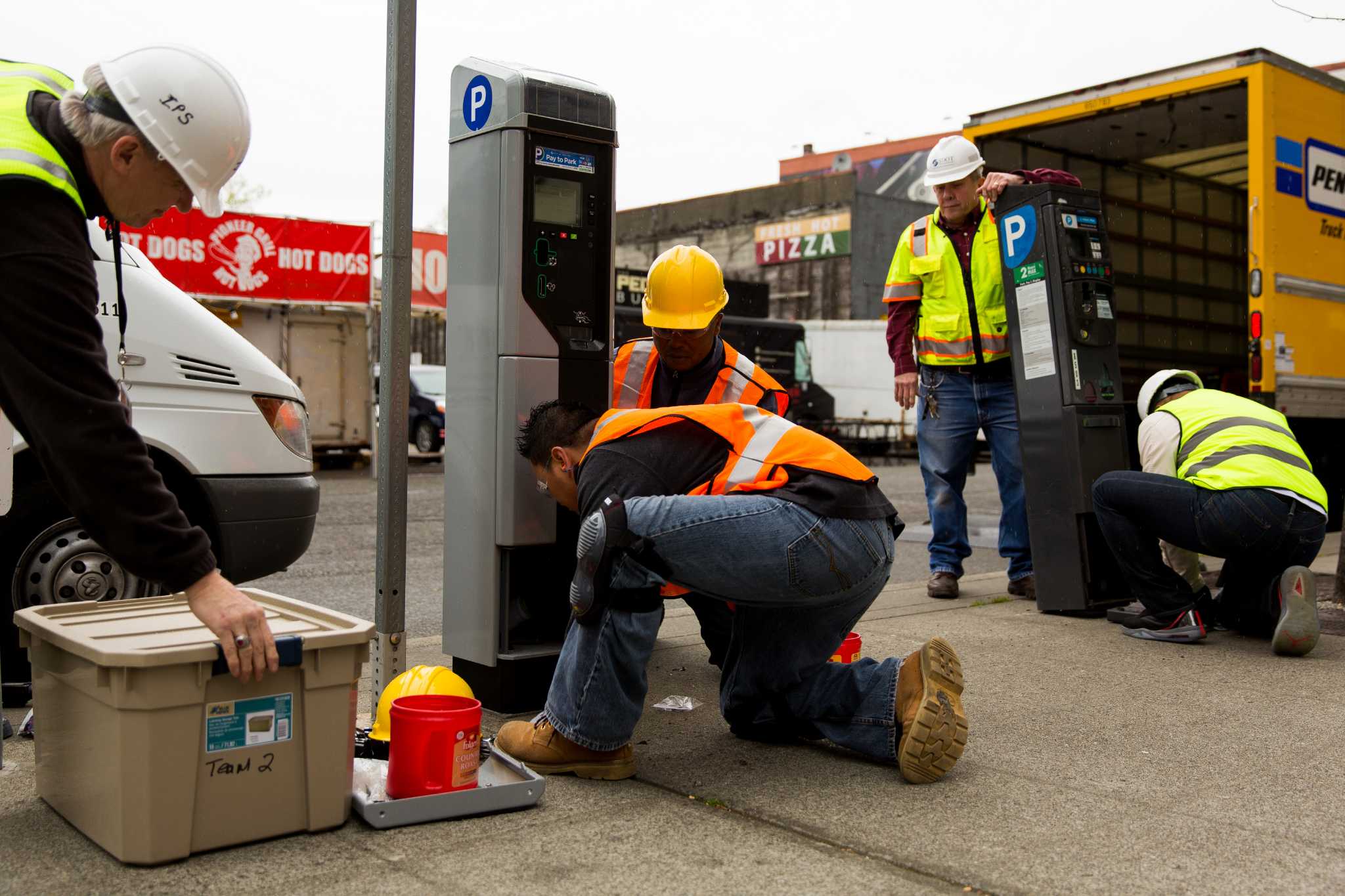 Crews install first of Seattle's 'smart' parking meters