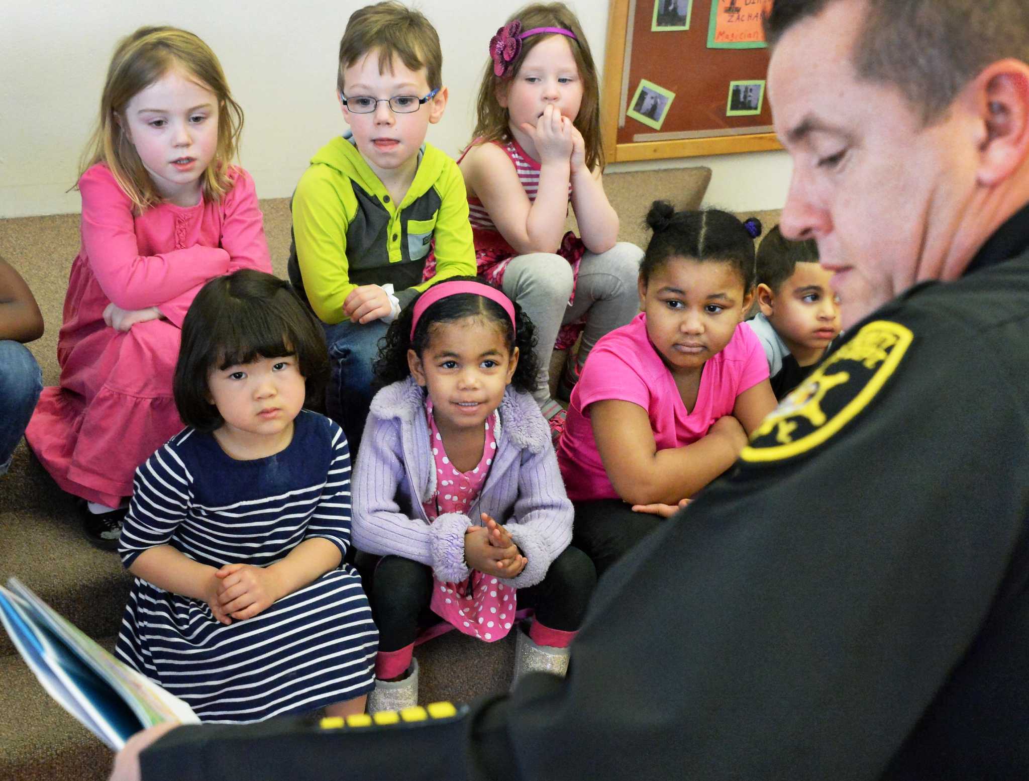 Officers read to Club Fed kids