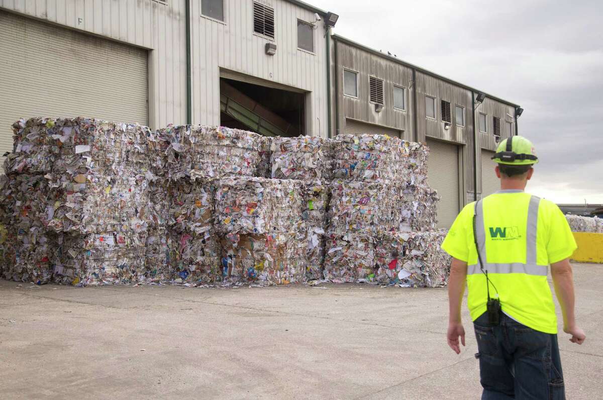 Recycling woes, less trash send Waste Management to a loss