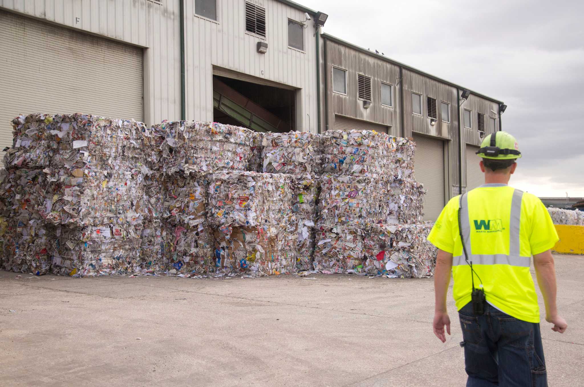 Recycling woes, less trash send Waste Management to a loss