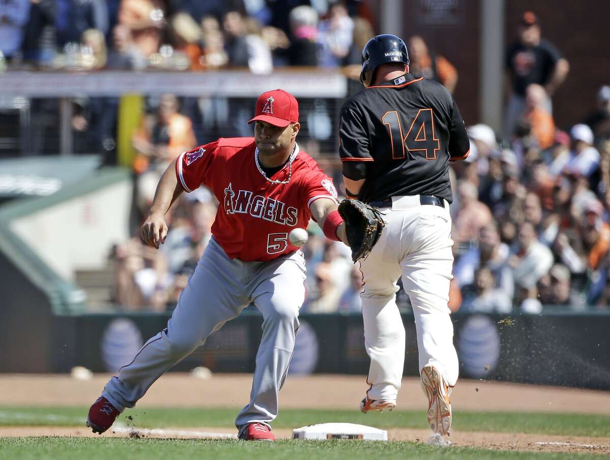 Tim Hudson gets win as Giants hold off Angels