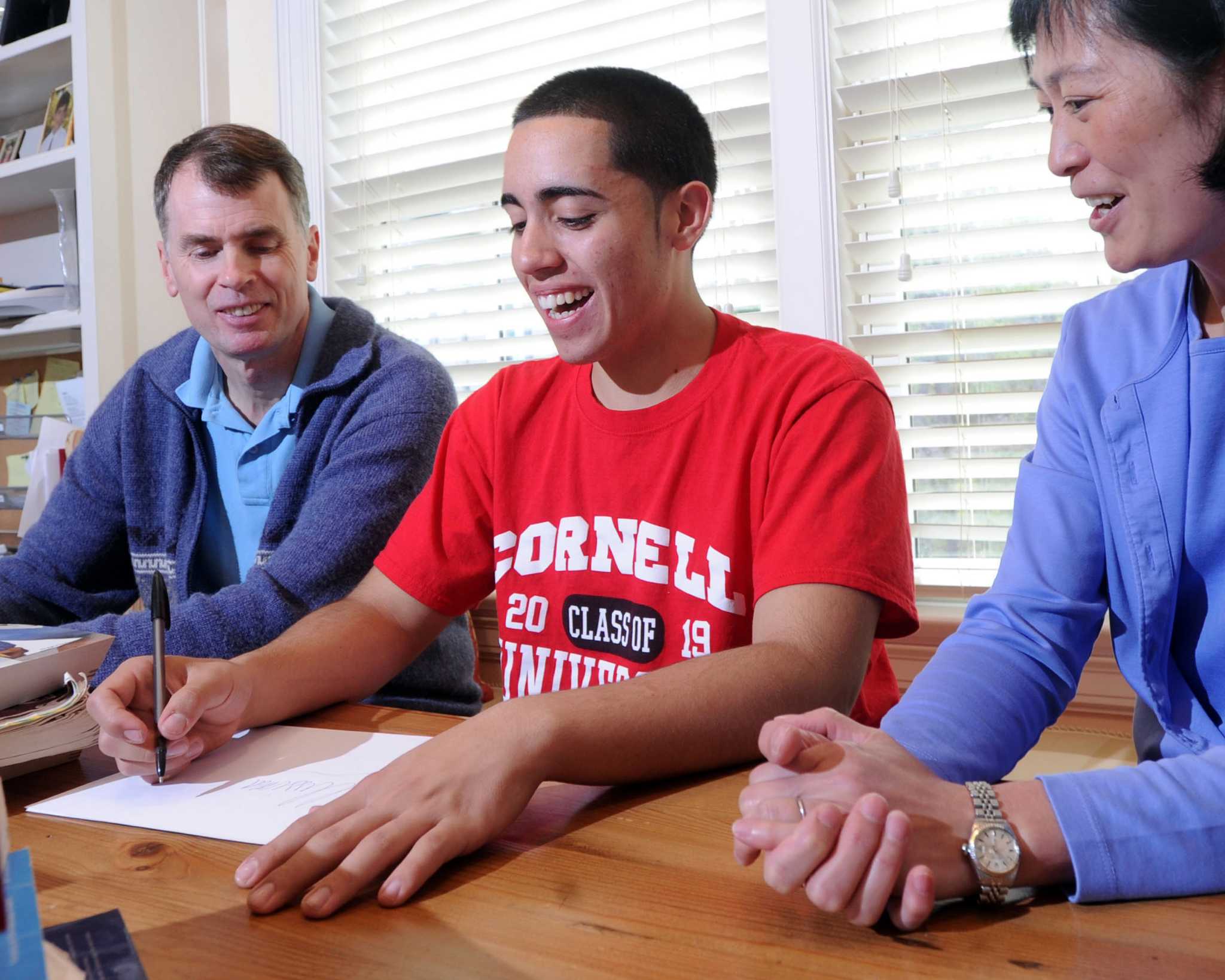 Couple help teenager realize college dream