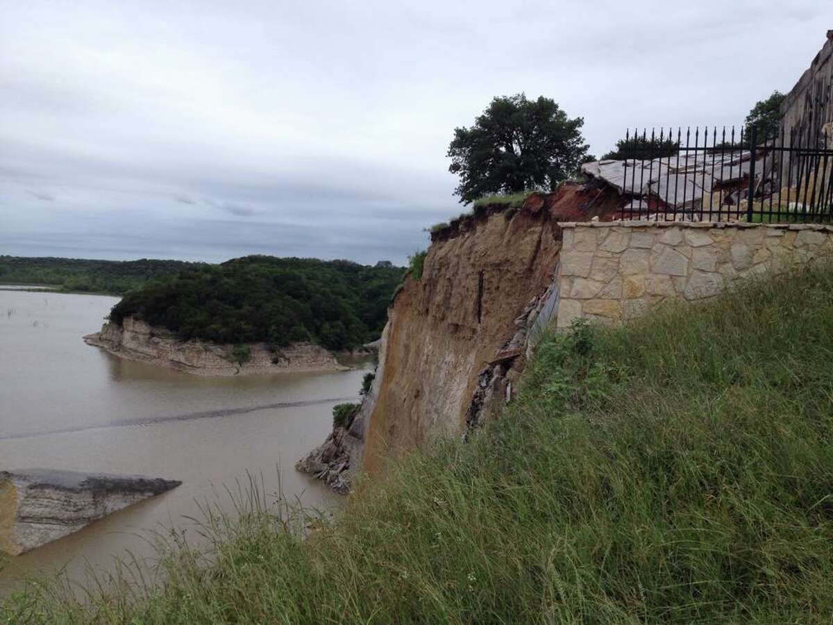 Rain-soaked cliff where burned luxury home once stood falls into Lake ...