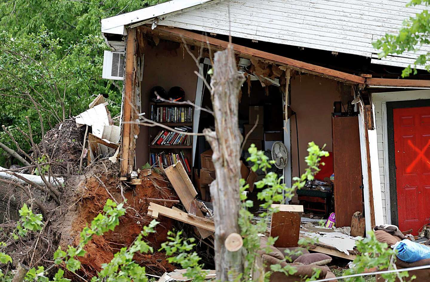 Retired police detective found dead with arm around dog after tornado