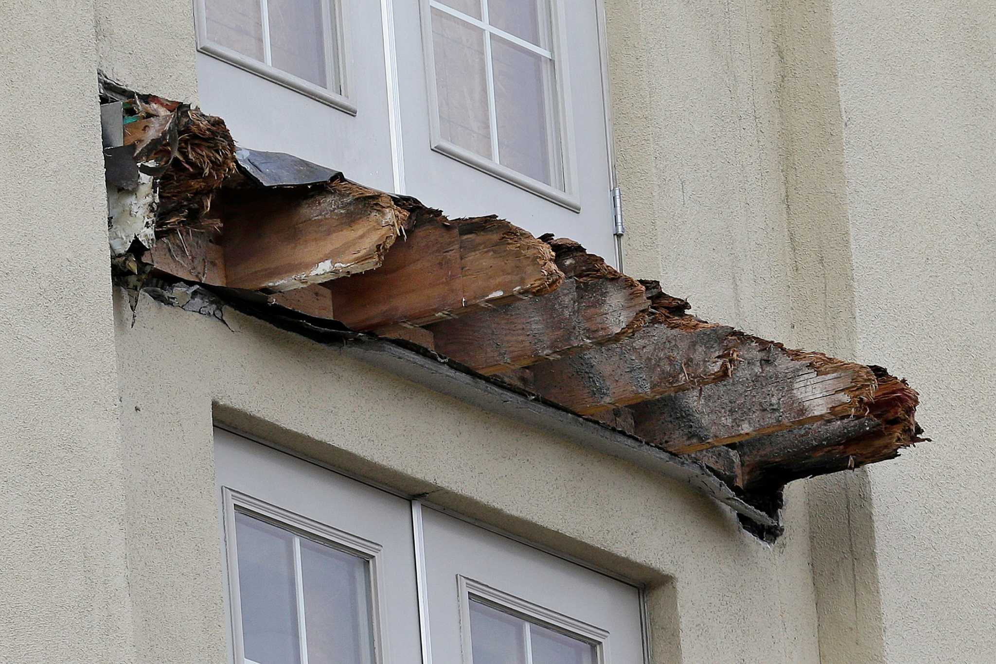 Deadly balcony collapse tied to rotted wooden beams