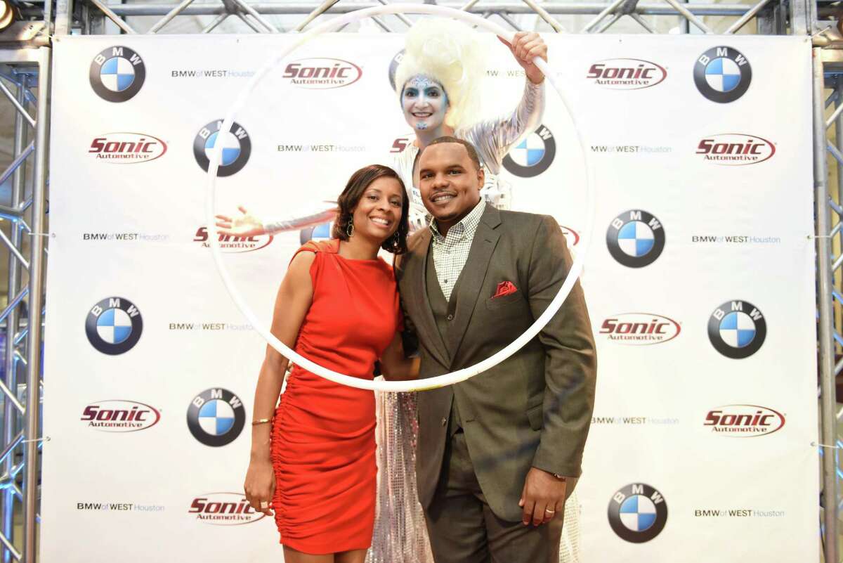 Former Rockets and Texans players celebrate the new BMW West Houston