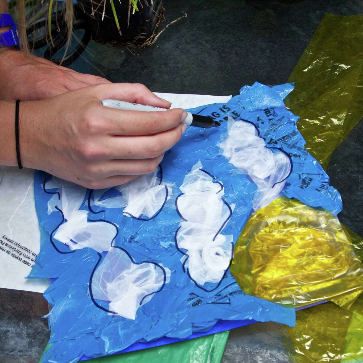 Make a collage with recycled plastic bags