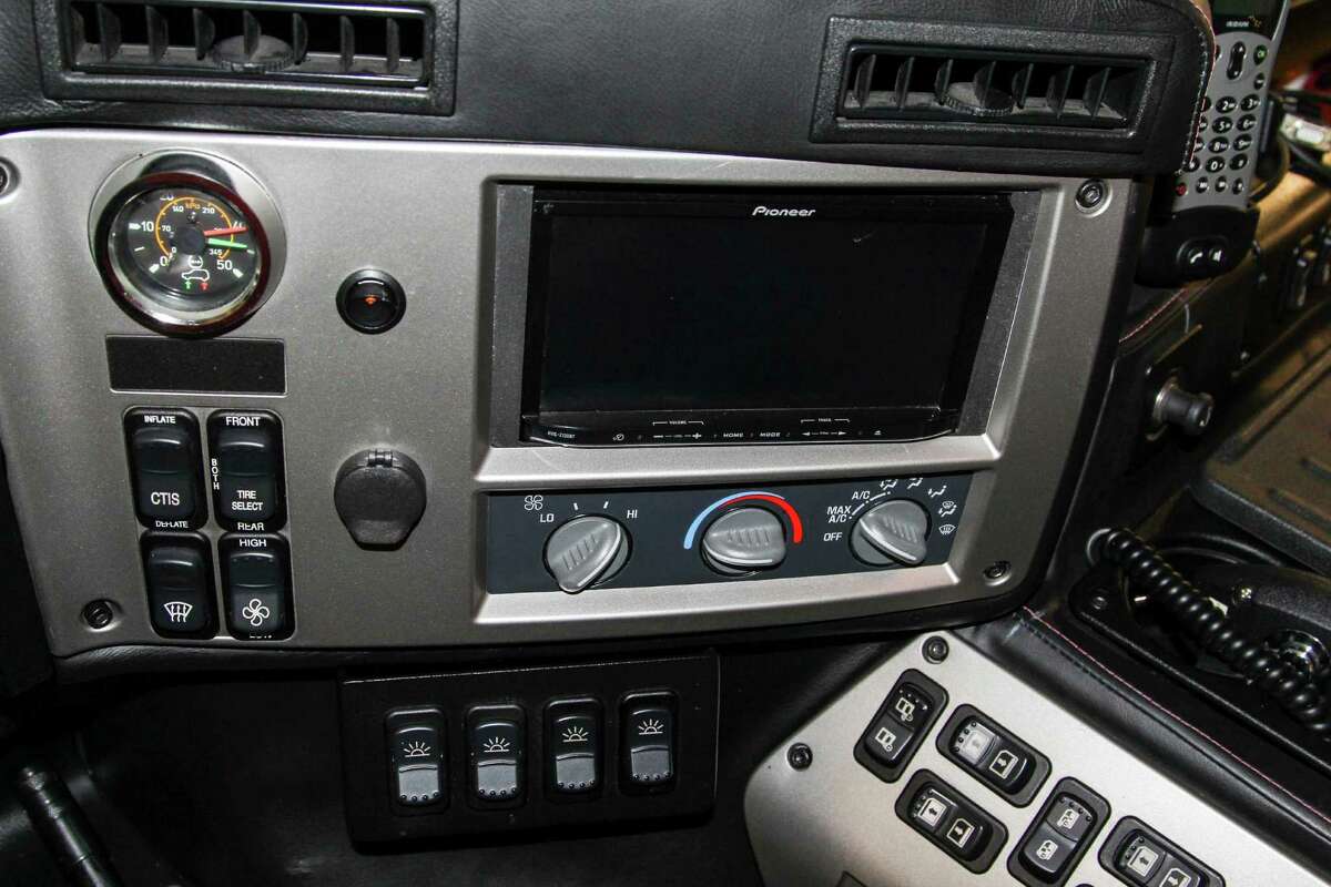 This decked out armored Hummer has shocking door handles, satellite TV ...