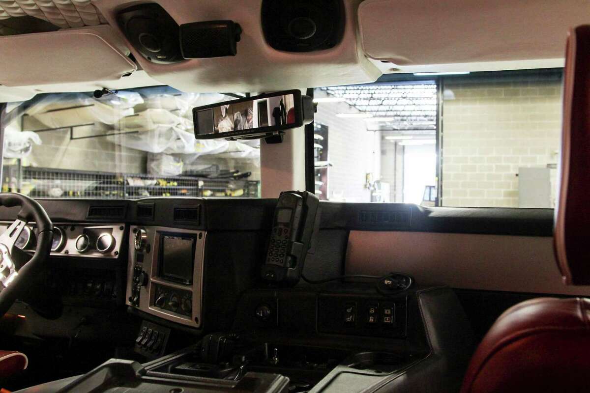 This decked out armored Hummer has shocking door handles, satellite TV ...