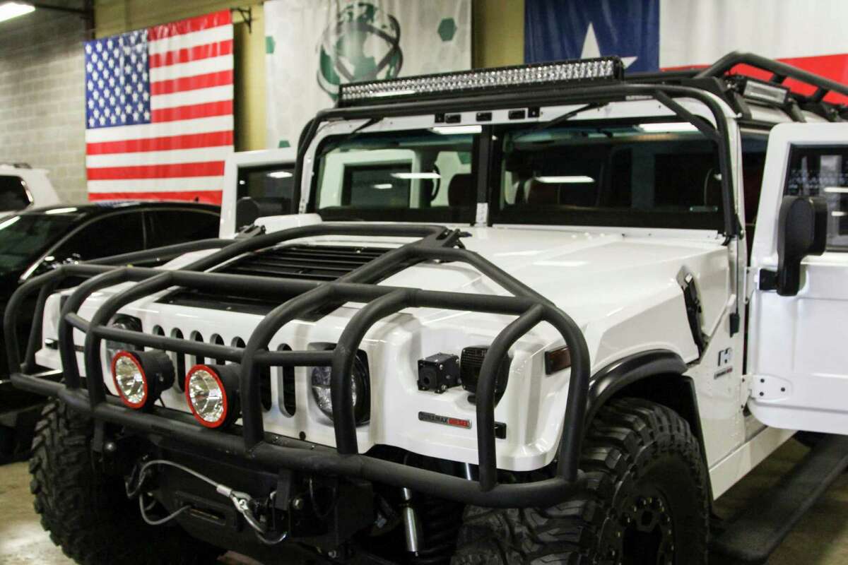 This decked out armored Hummer has shocking door handles, satellite TV ...