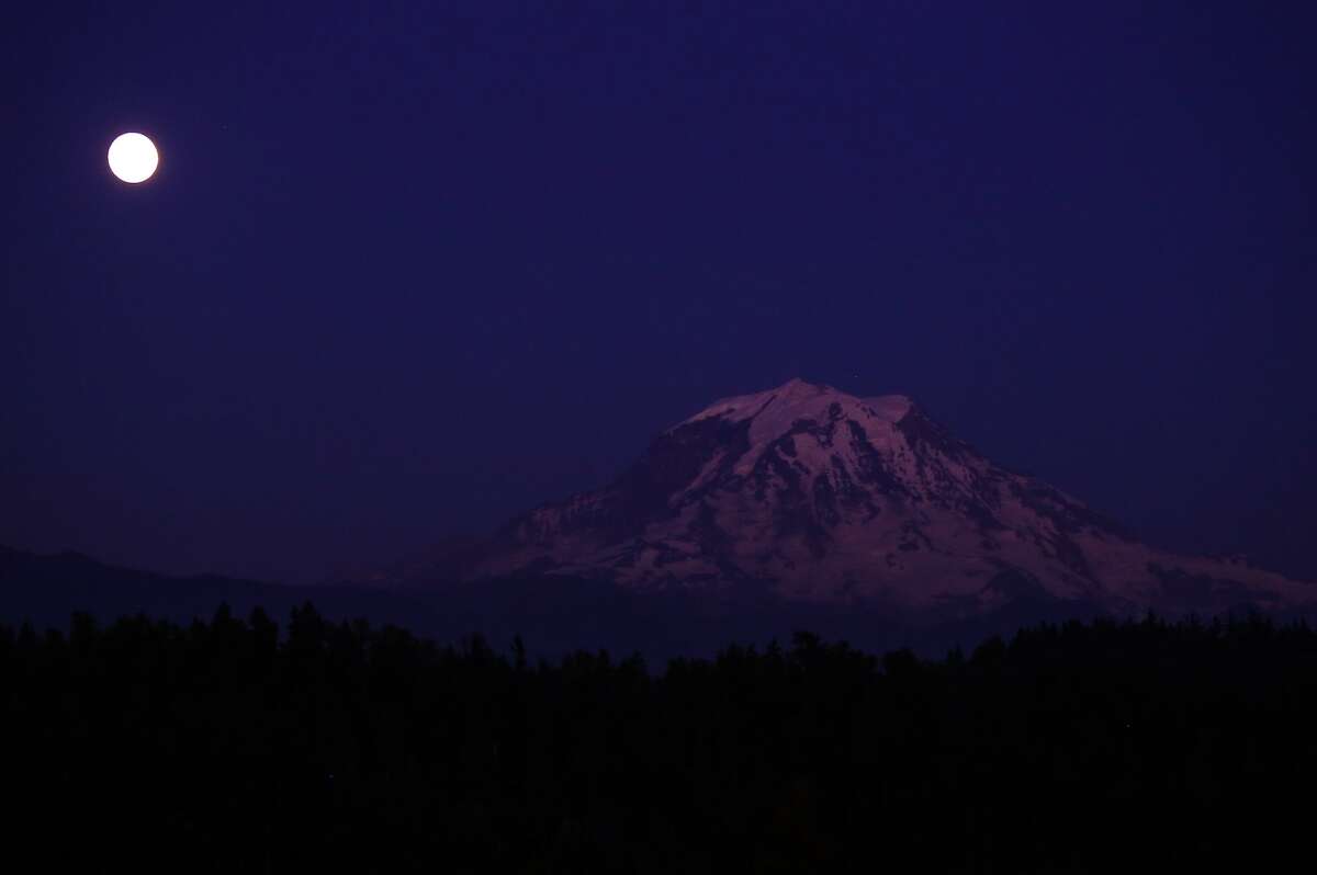 Full moon shines over Mount Rainier