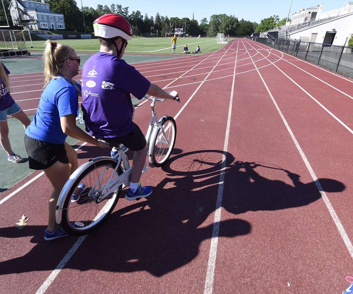 Disabled children learn to ride 2-wheel bikes at Union