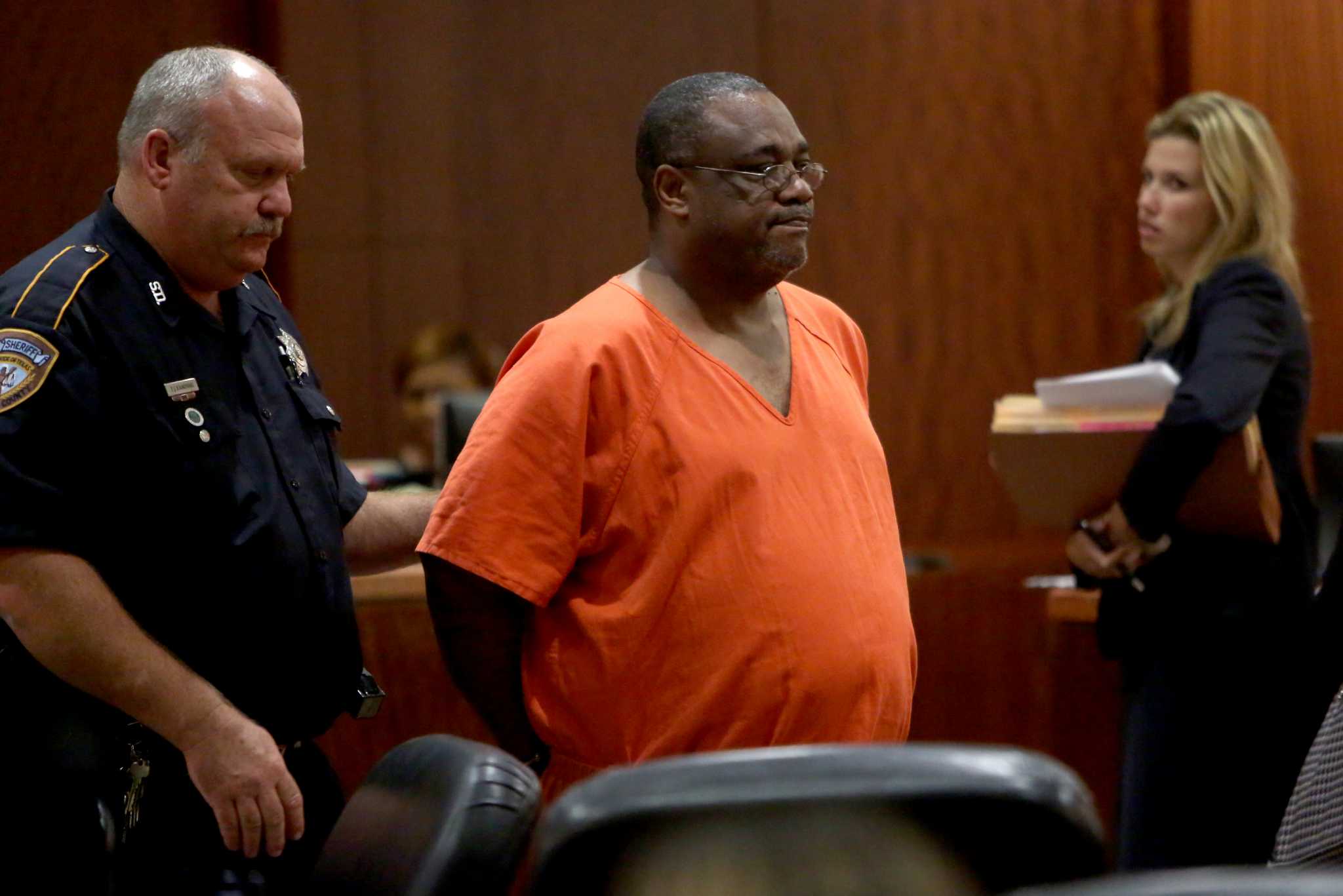 Through a courtroom window, son watches father answer to murder charge