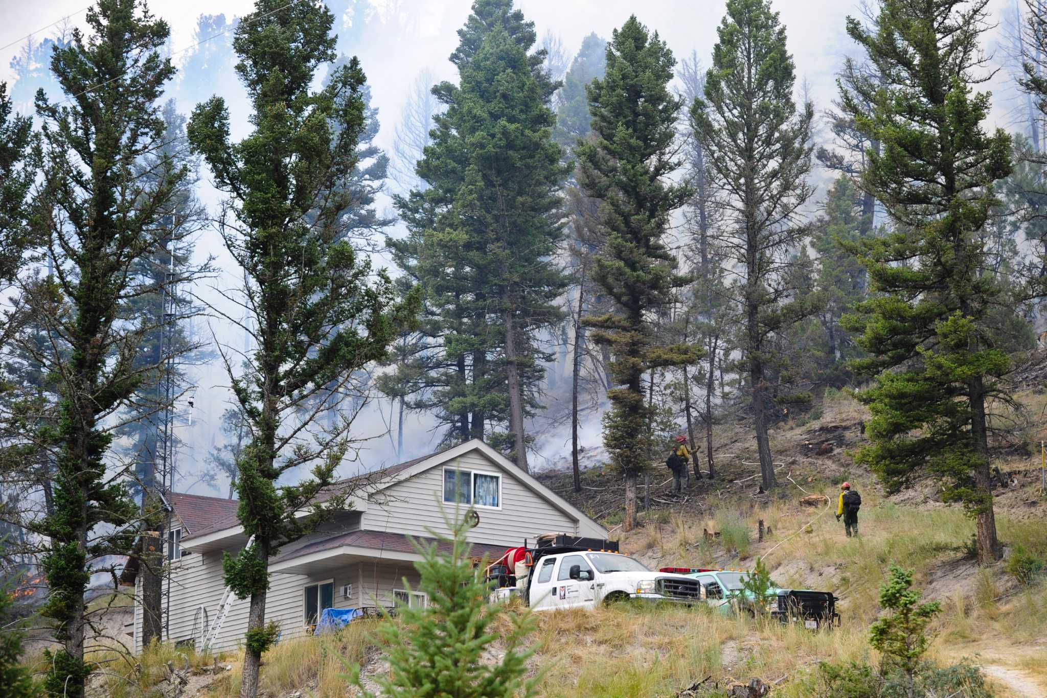 Western wildfires threatening homes and disrupting tourism
