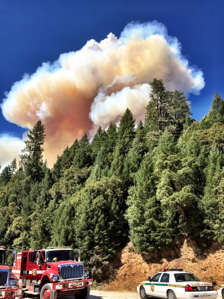 Crews battle stubborn wildfires, gird for heat wave