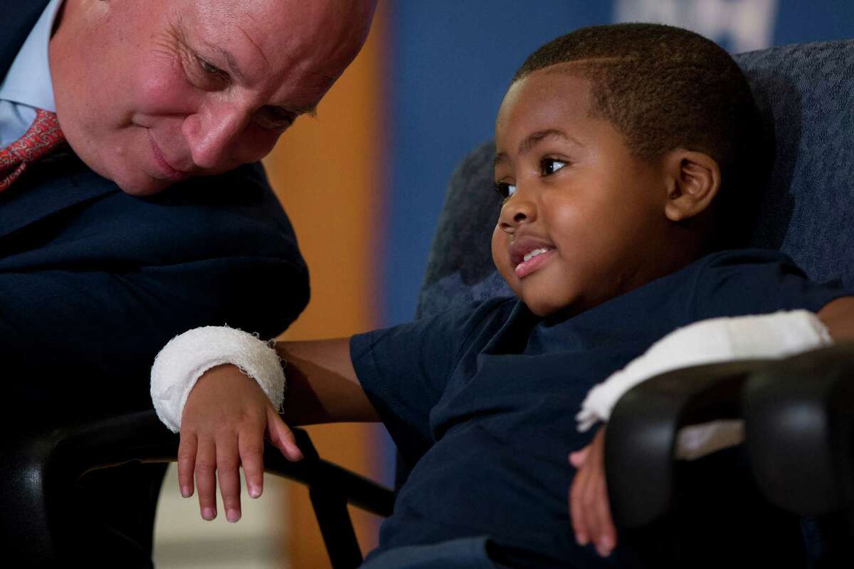 Boy who lost hands to infection gives double thumbs up after surgery