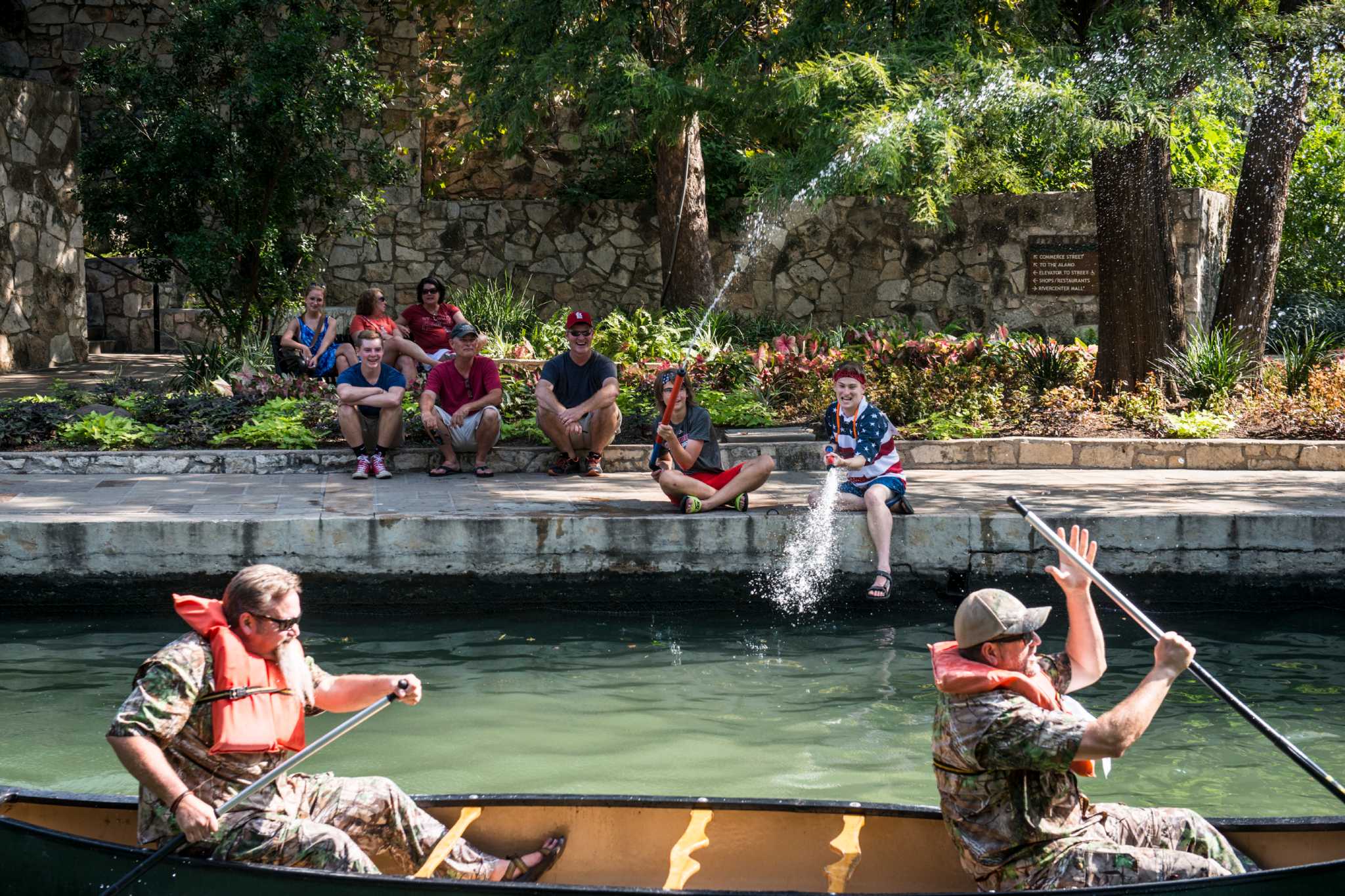 Paddling, sinking, smiling mark canoe races on River Walk