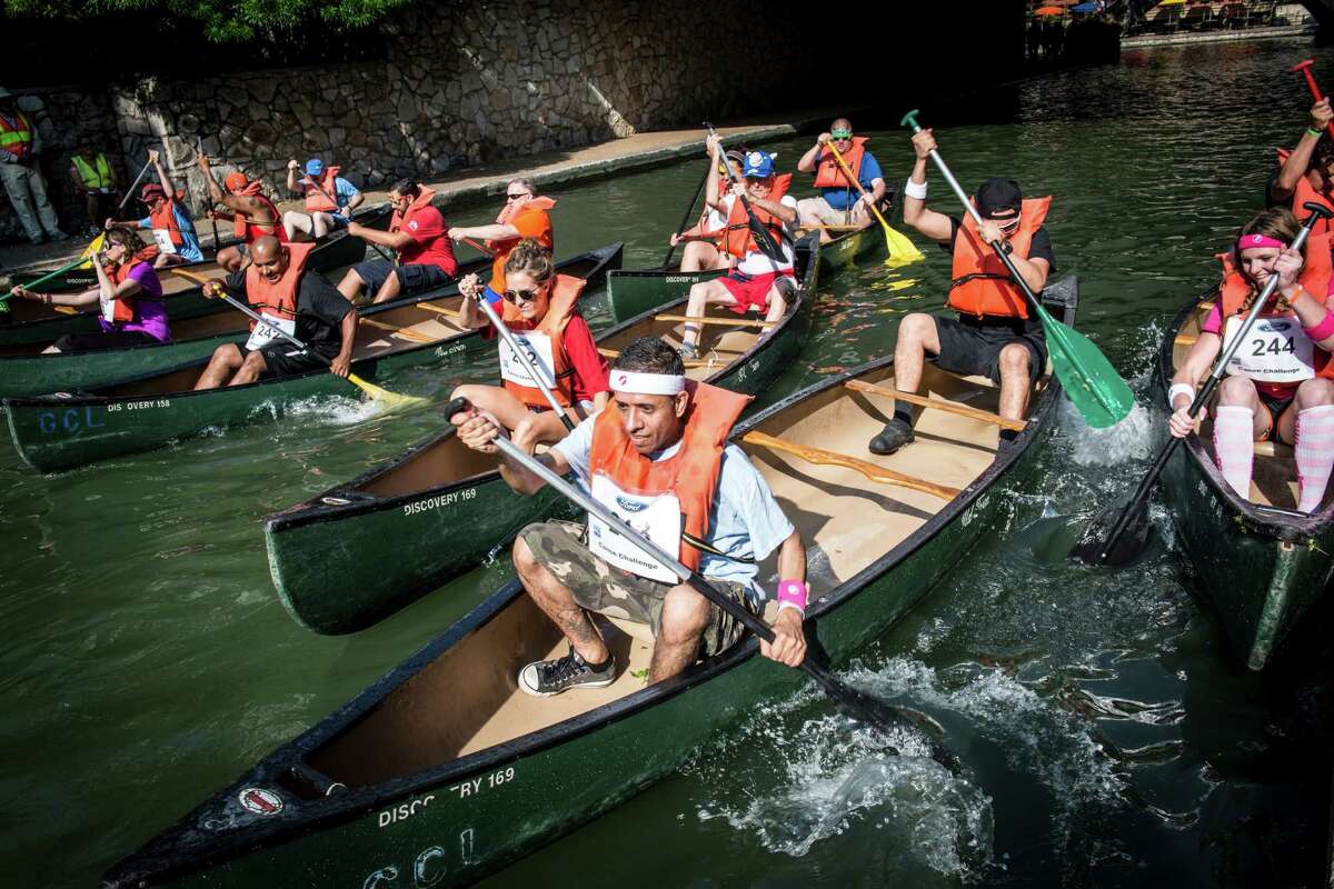 Paddling, sinking, smiling mark canoe races on River Walk