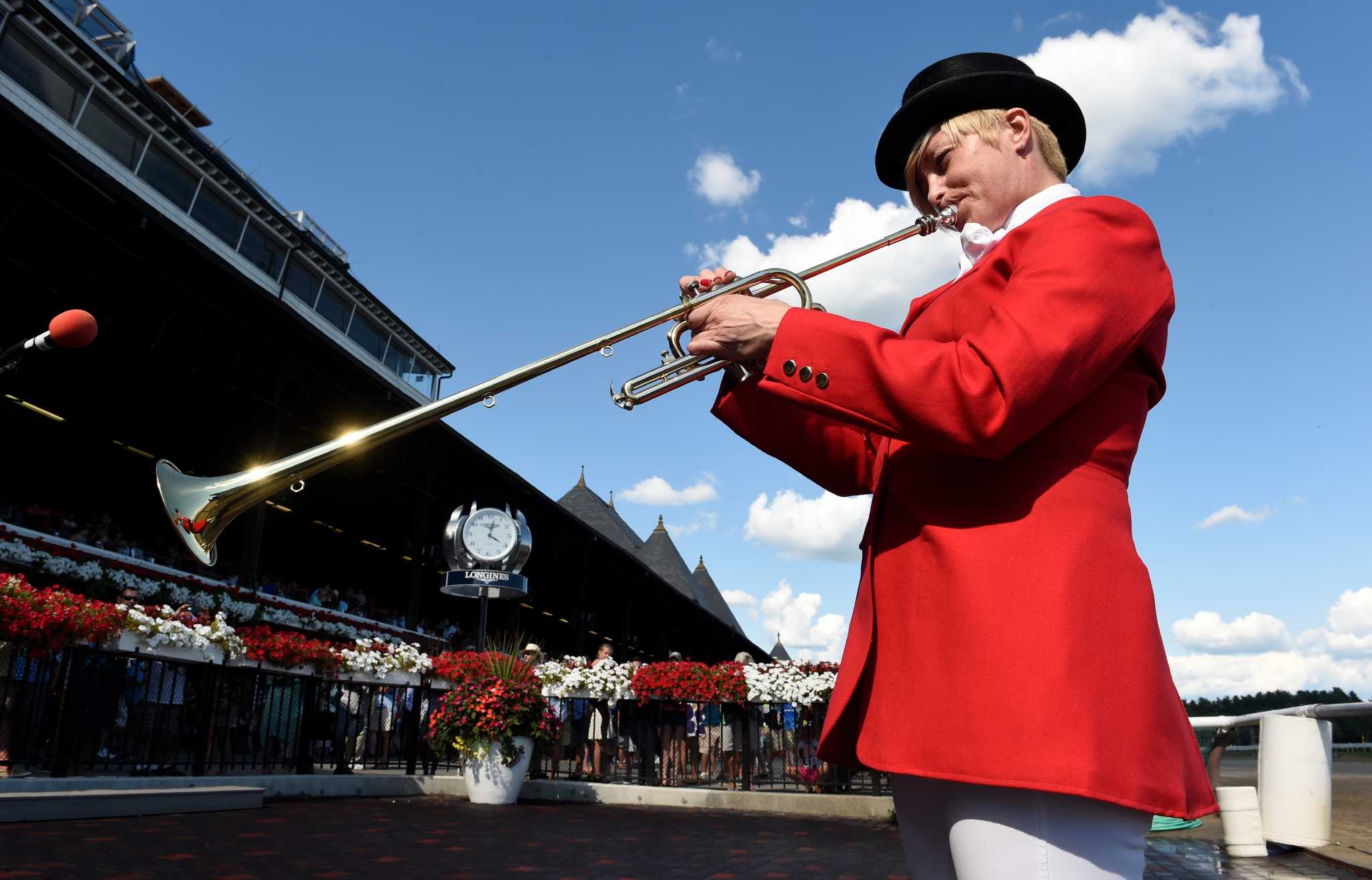 Sam the Bugler says he'll be back after security escort from track