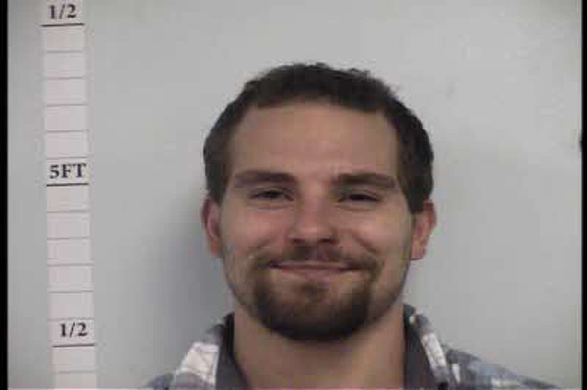 Gun activist charged in domestic violence