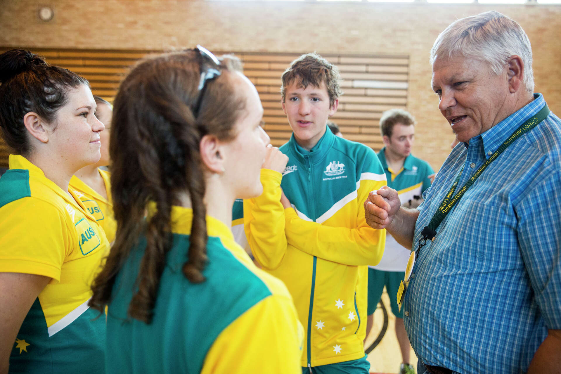 Deaf competitive swimmers share tips with students at Sunshine Cottage