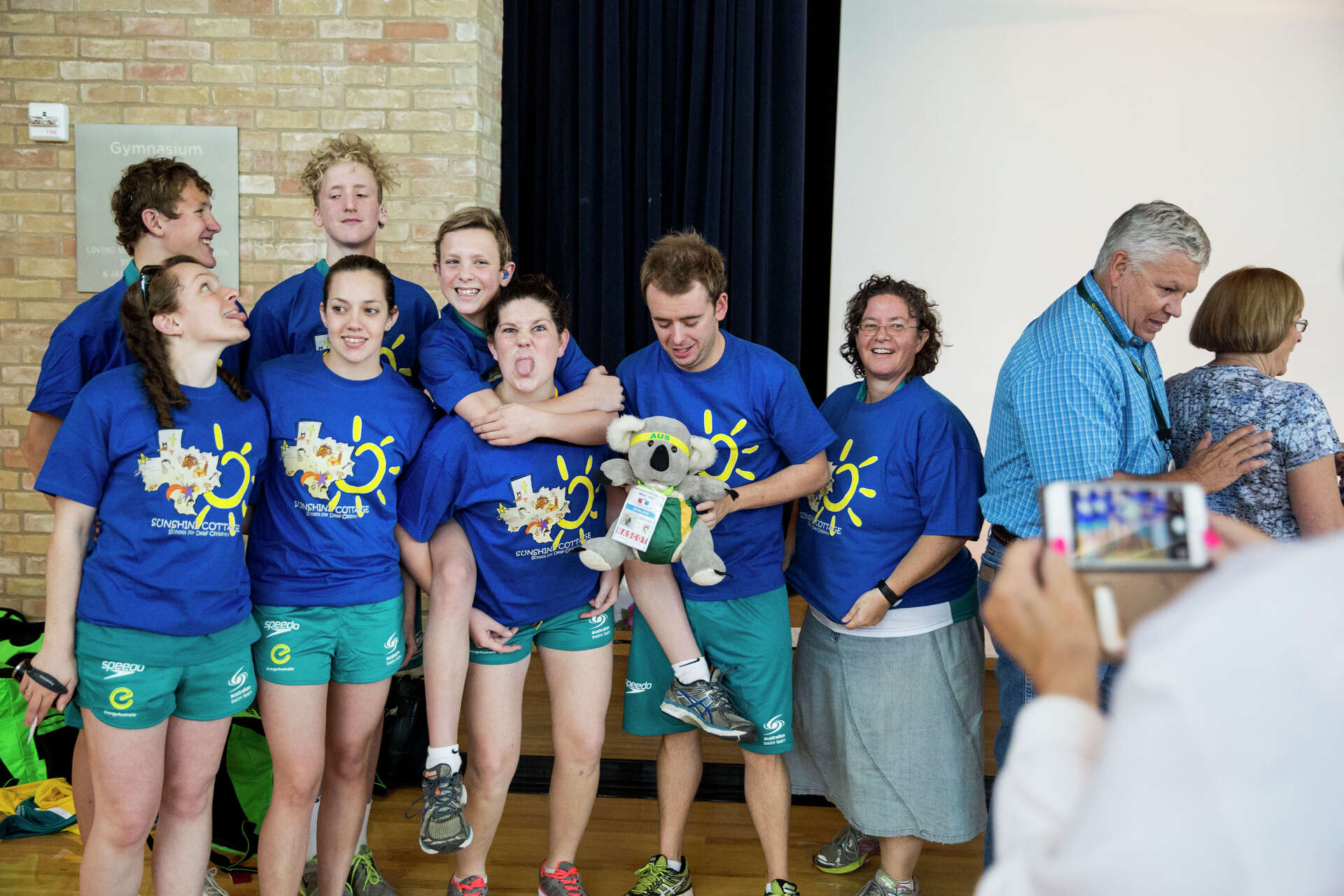 Deaf competitive swimmers share tips with students at Sunshine Cottage