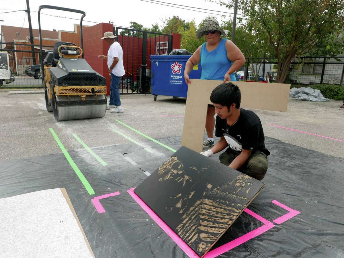 Artists create steamroller prints at block party