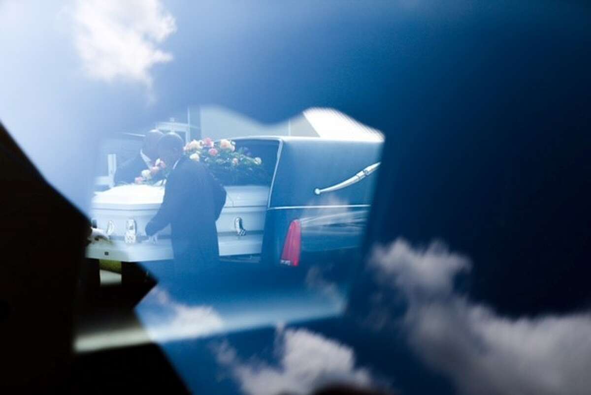 Mourners remember eight family members slain in their home