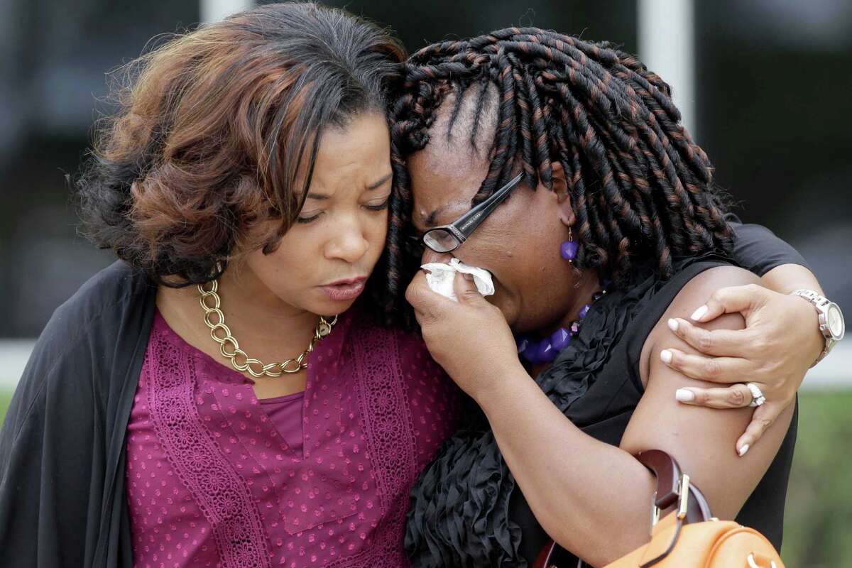 Mourners remember eight family members slain in their home