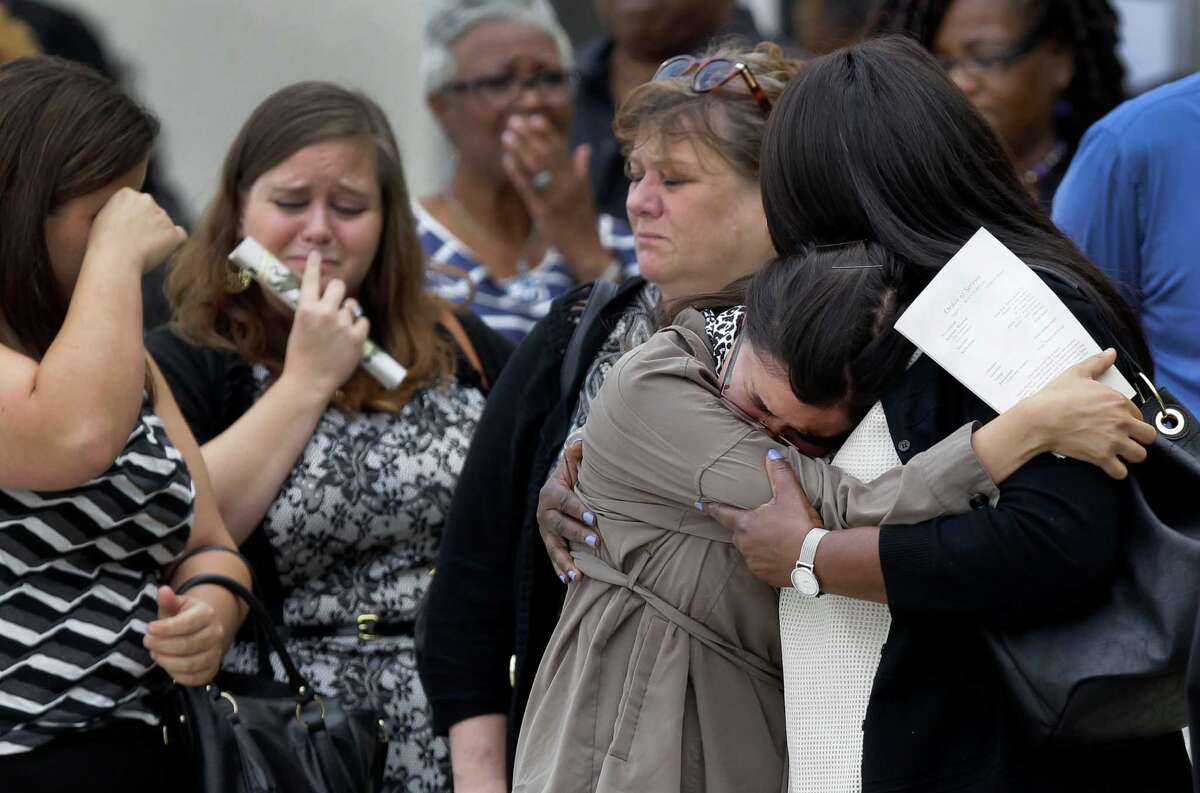 Mourners remember eight family members slain in their home