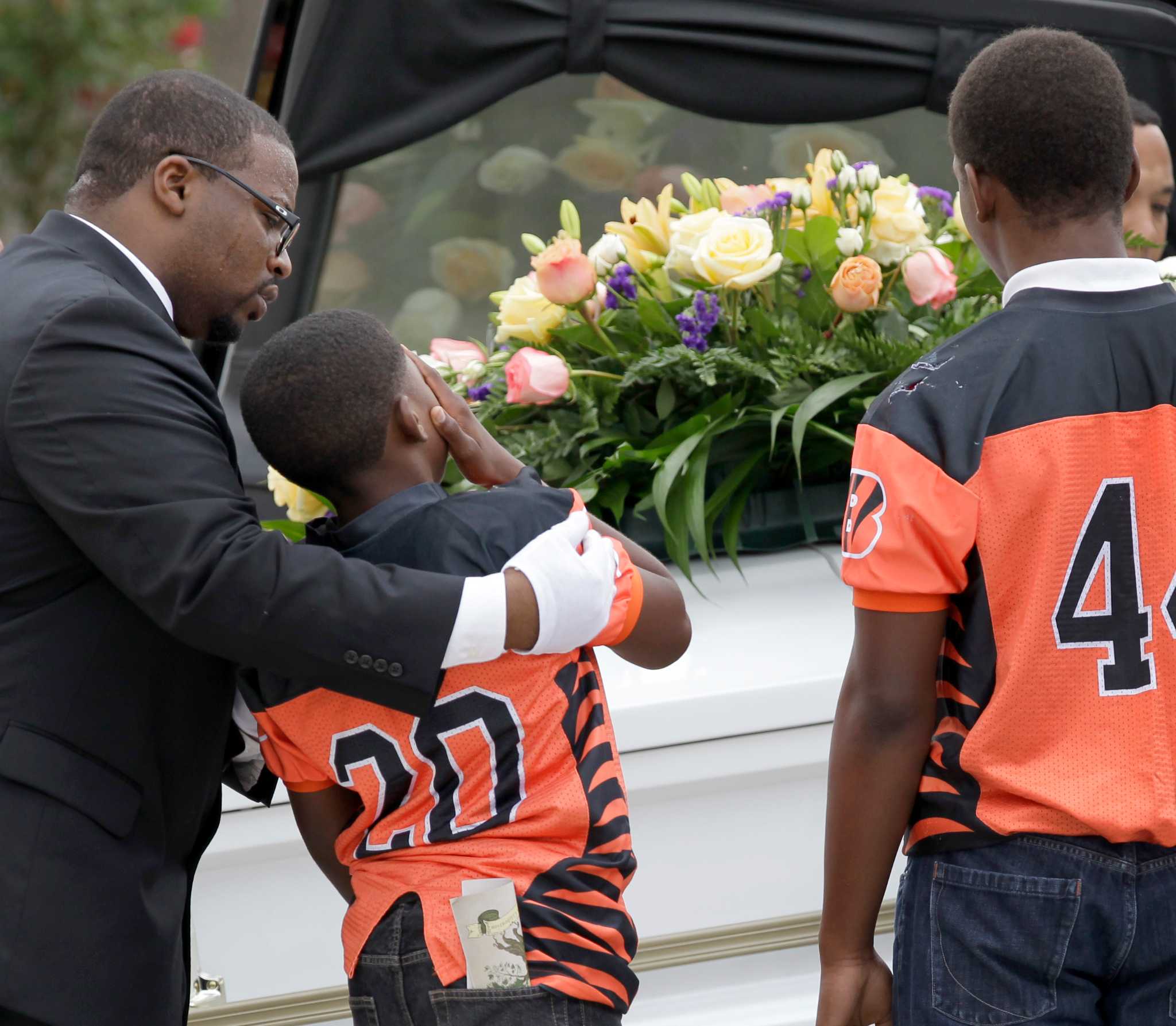 Mourners remember eight family members slain in their home