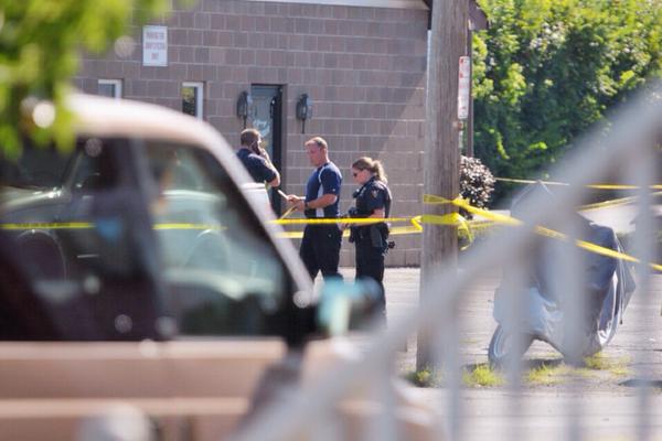 Officers hurt in Troy shooting on mend; dead man's friends have questions