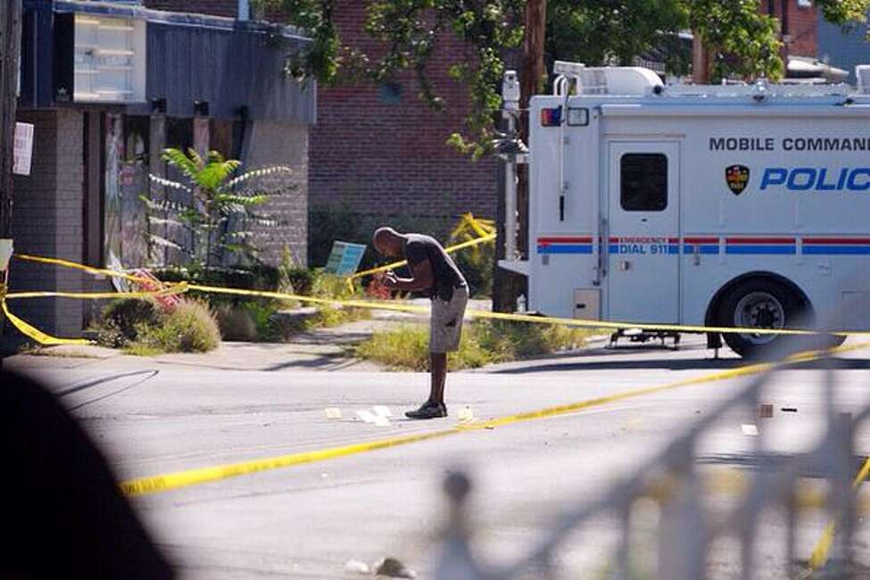 Officers hurt in Troy shooting on mend; dead man's friends have questions