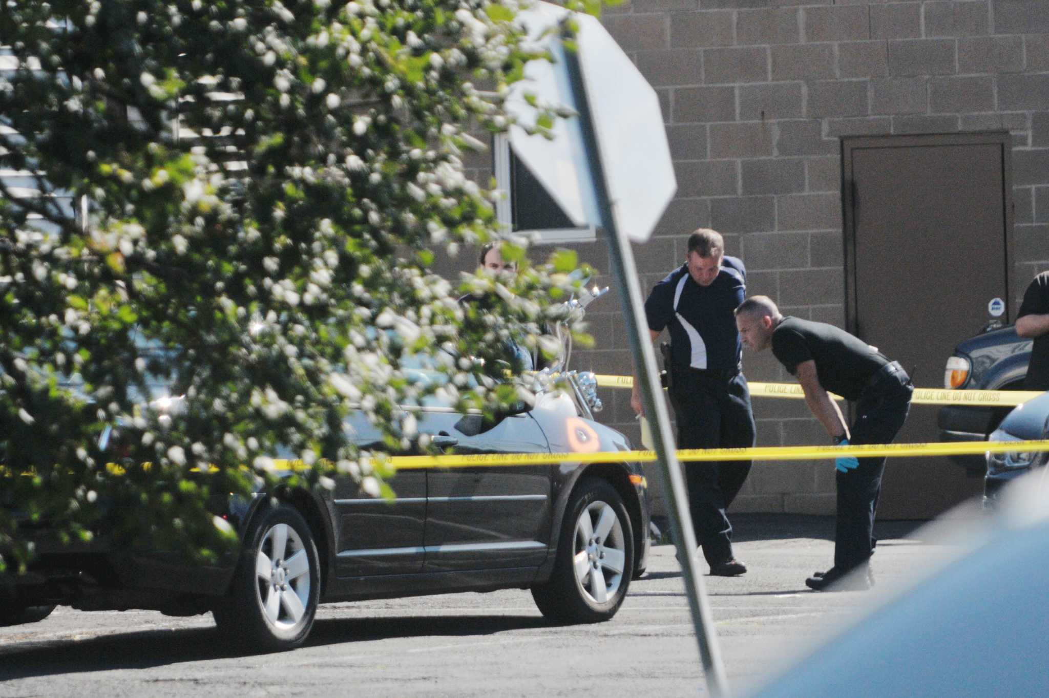 Officers hurt in Troy shooting on mend; dead man's friends have questions