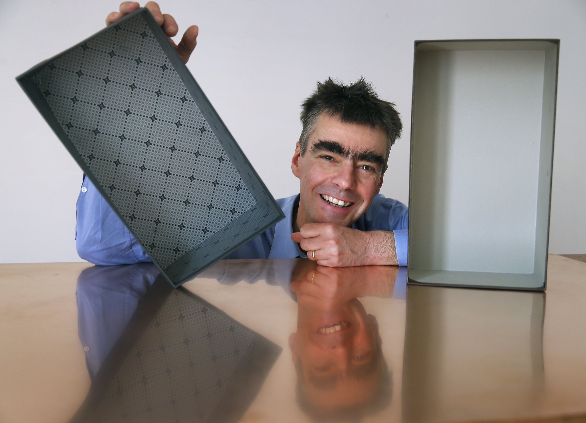 Shoe boxes? As art? Photographer showcases beauty of the container