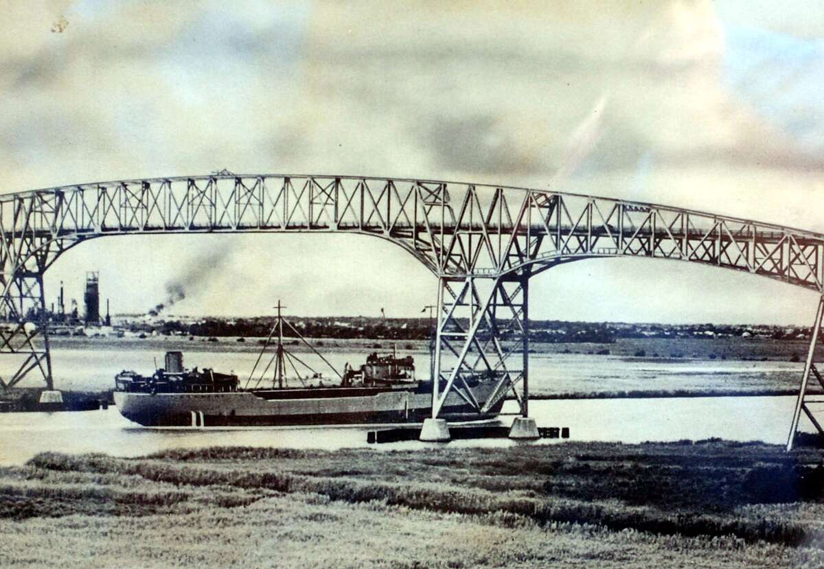 1957 photo of painters atop Rainbow Bridge shows level of danger