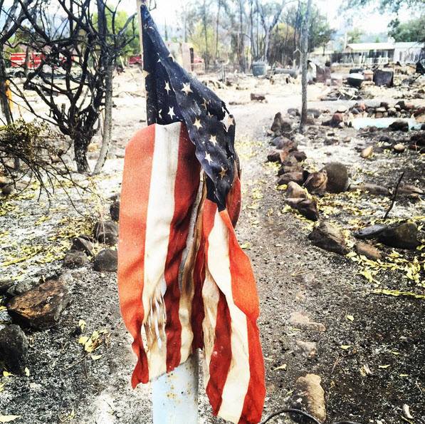 American Flag survives Valley Fire, charred but still waving
