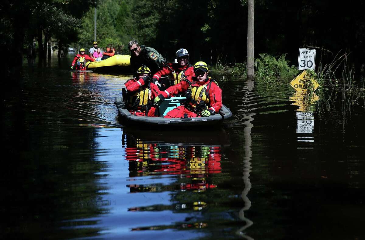 South Carolina still on edge from floods; 2 die in truck