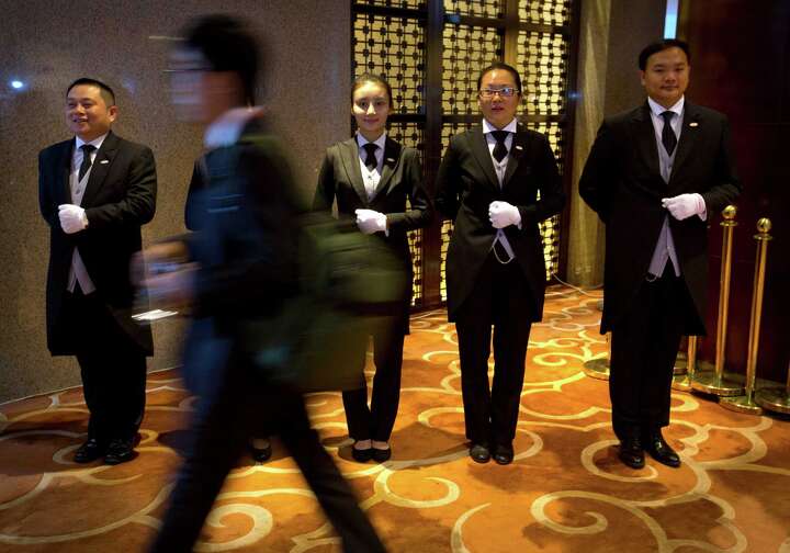 White-gloved butlers a new must-have for China's super-rich
