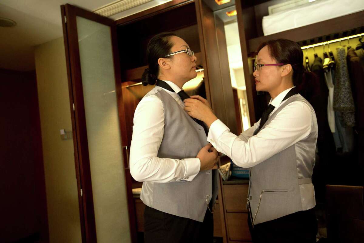 White-gloved butlers a new must-have for China's super-rich