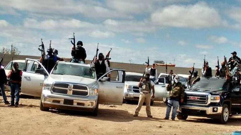 Masked assassins for the Juárez Cartel in Mexico shown holding guns in leaked photos - San ...