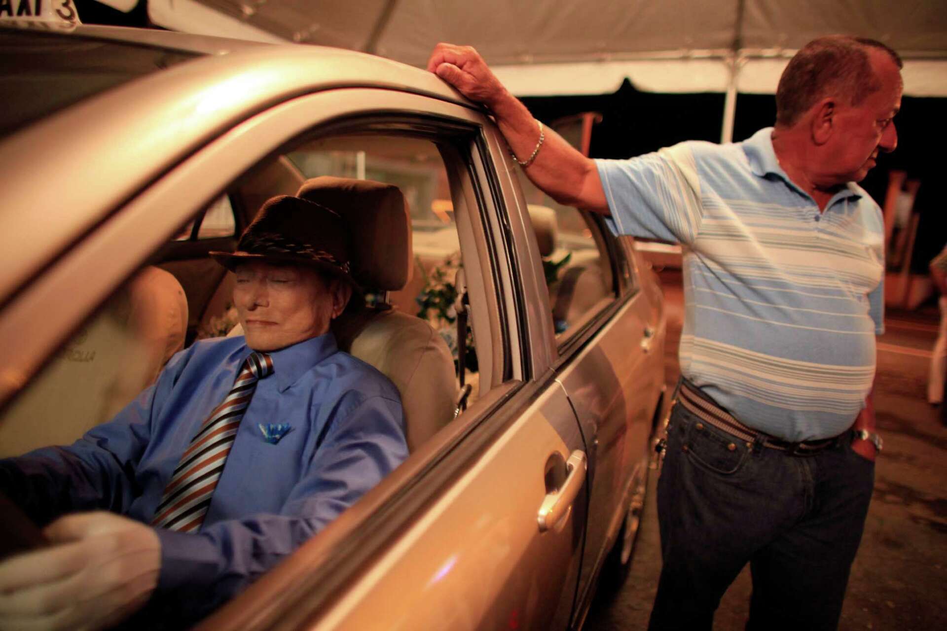Puerto Rico gangster propped up, playing dominoes at his funeral
